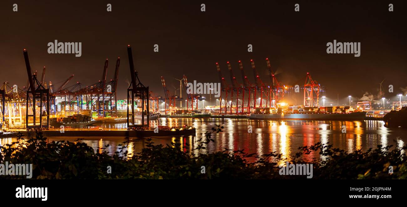 Hamburg harbor: container terminal in the port of Hamburg at night ...