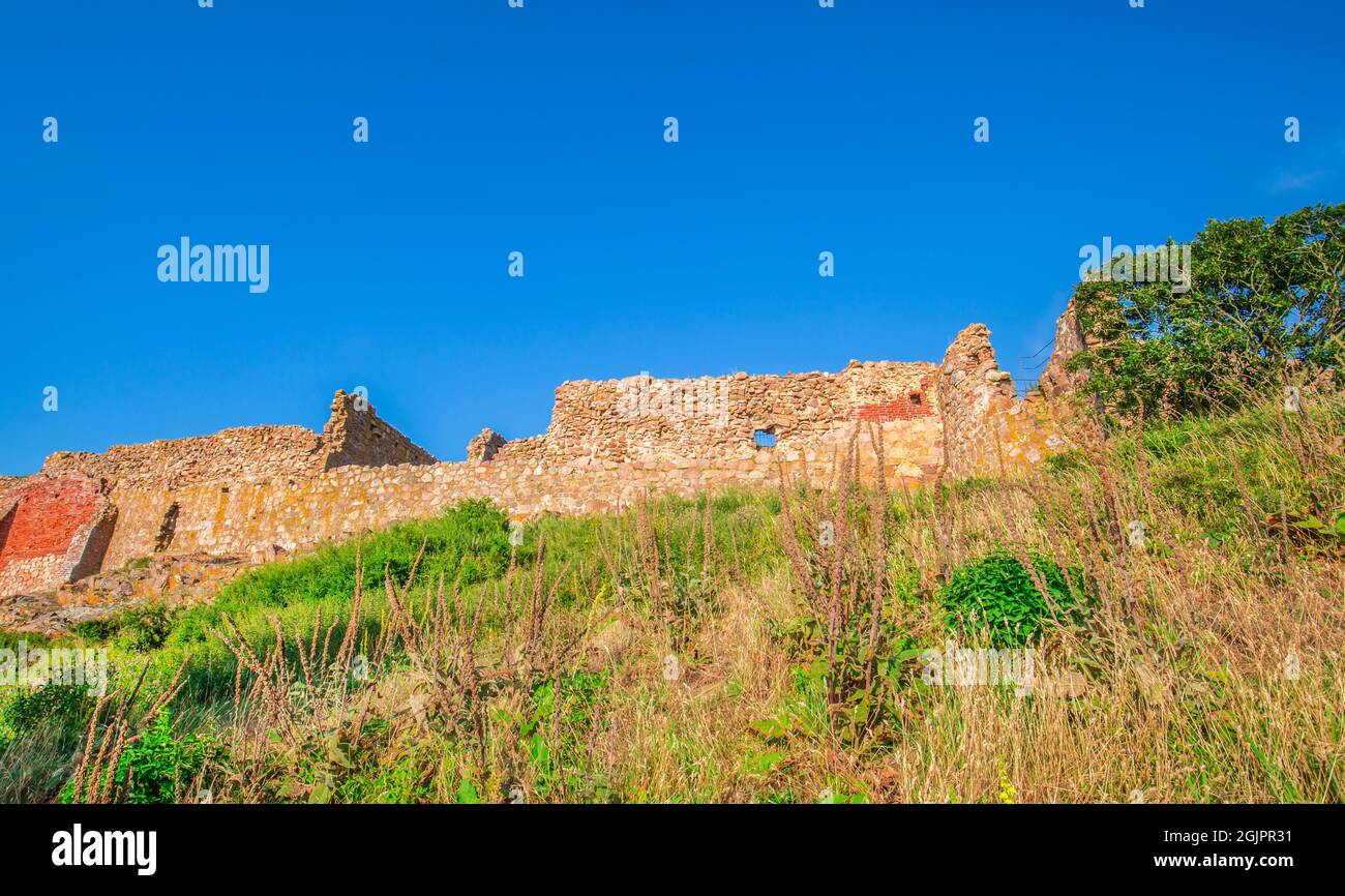 Rocky coastal area around Hammershus Ruins Castle in Bornholm, Denmark ...