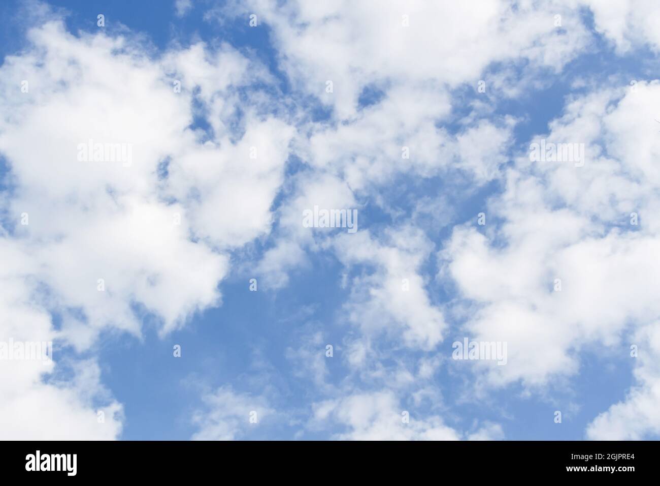 Blue Spring Sky with Fluffy Clouds. Clear bright sky Stock Photo - Alamy