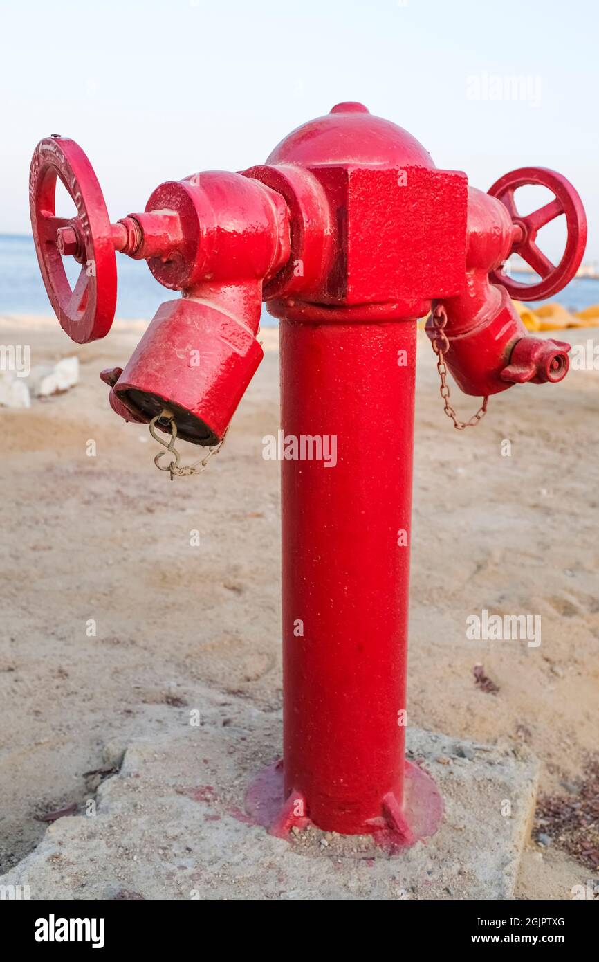 Close-up of a red fire hydrant in the desert. Sand and sea. Beach Stock ...