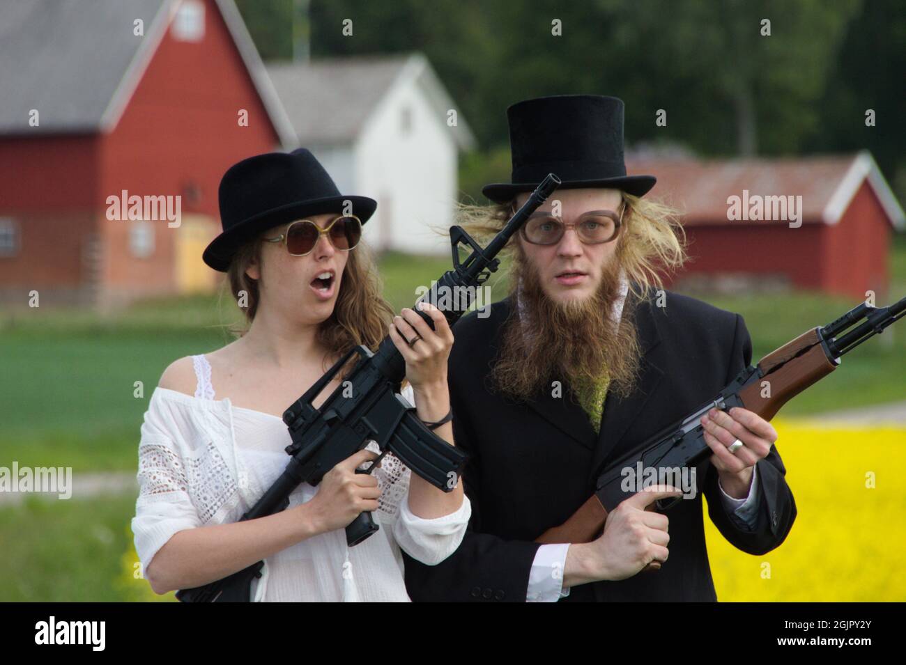Couple holding guns hi-res stock photography and images - Alamy