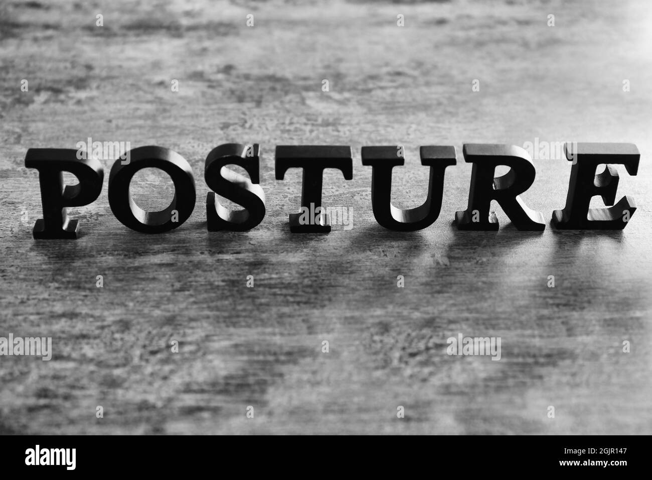 Black letters forming word POSTURE on gray background Stock Photo - Alamy