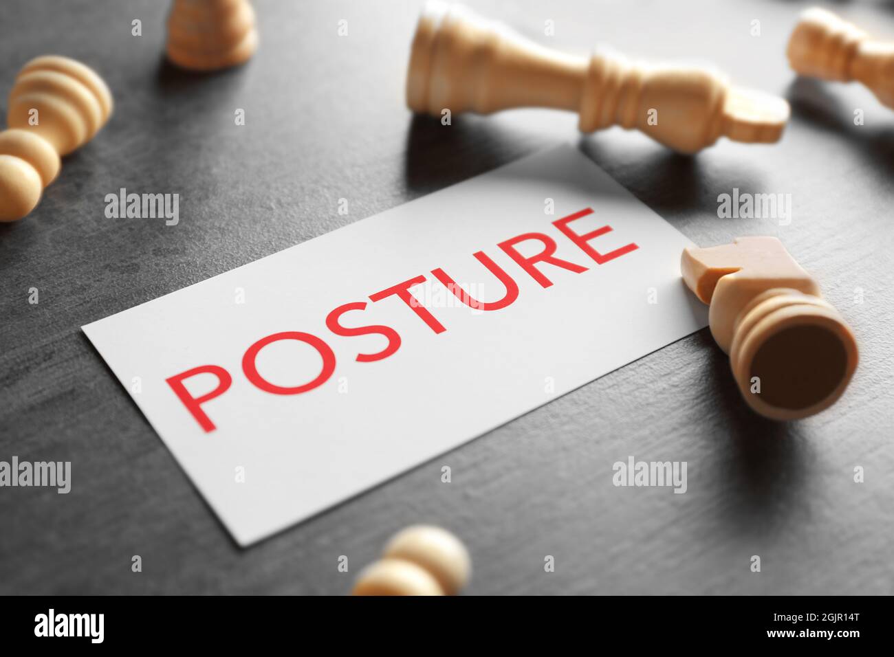 Paper with word POSTURE and chess pieces on gray background Stock Photo ...