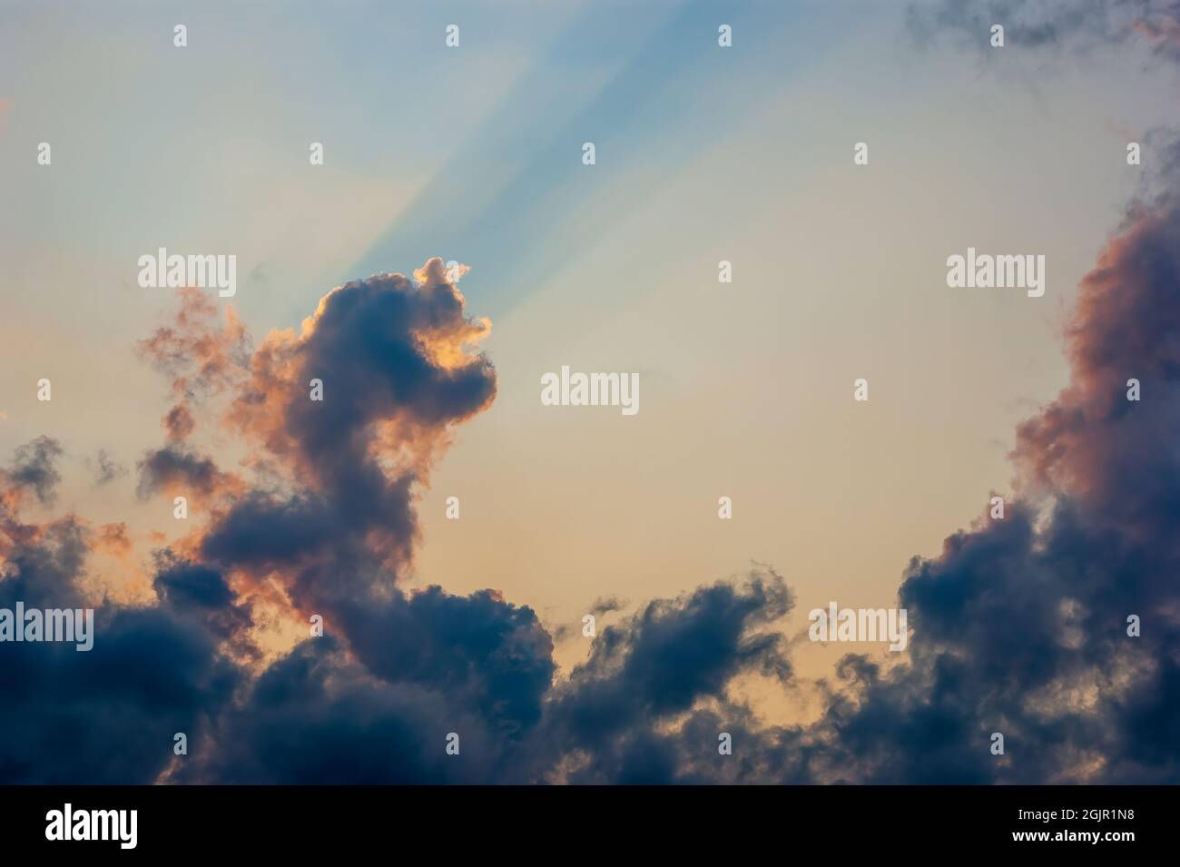 Cloudscape with a teddy bear-like cloud formation, in a warm sunset ...