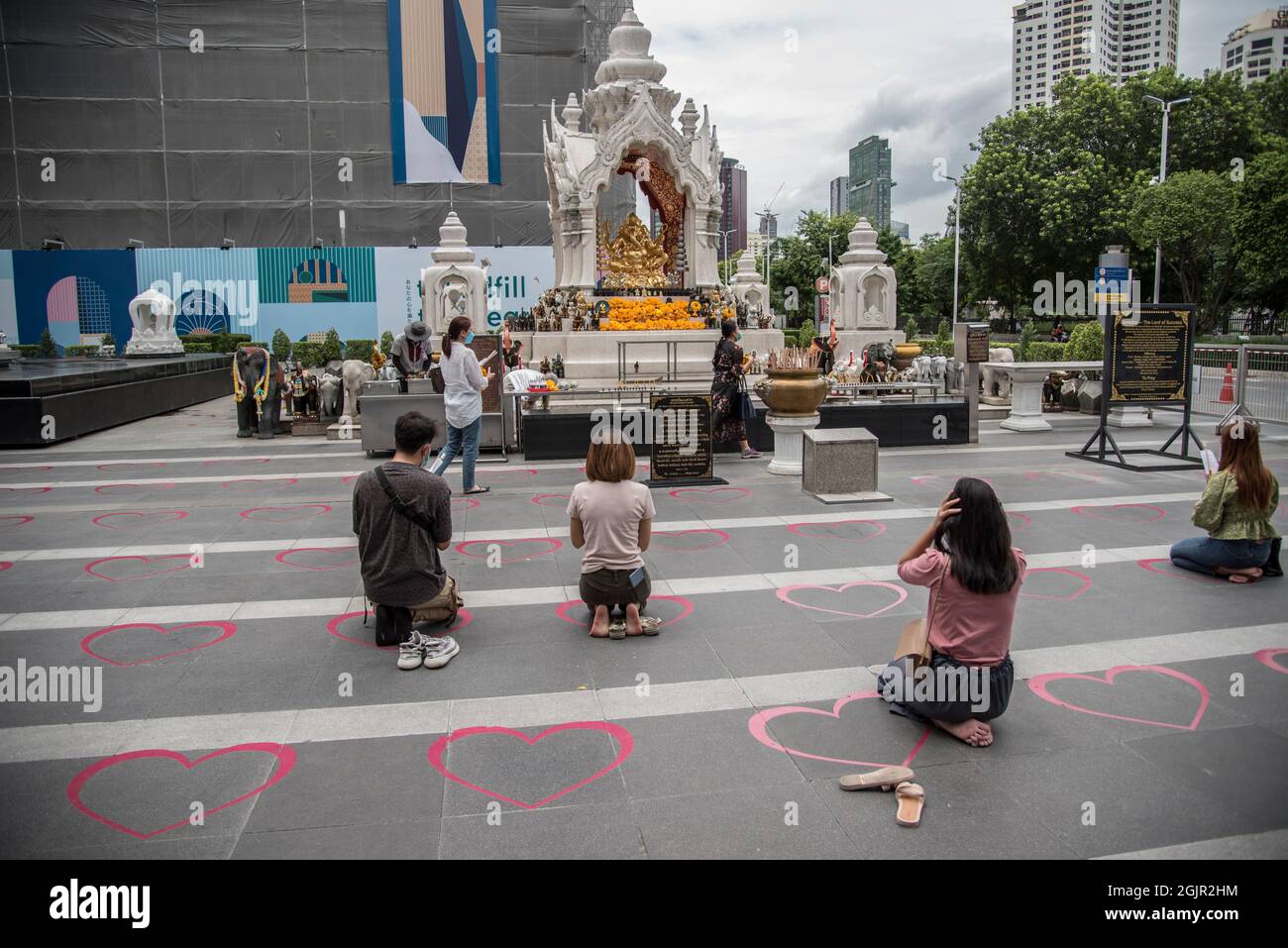 Bangkok, Thailand. 11th Sep, 2021. People pray while keeping a safe ...