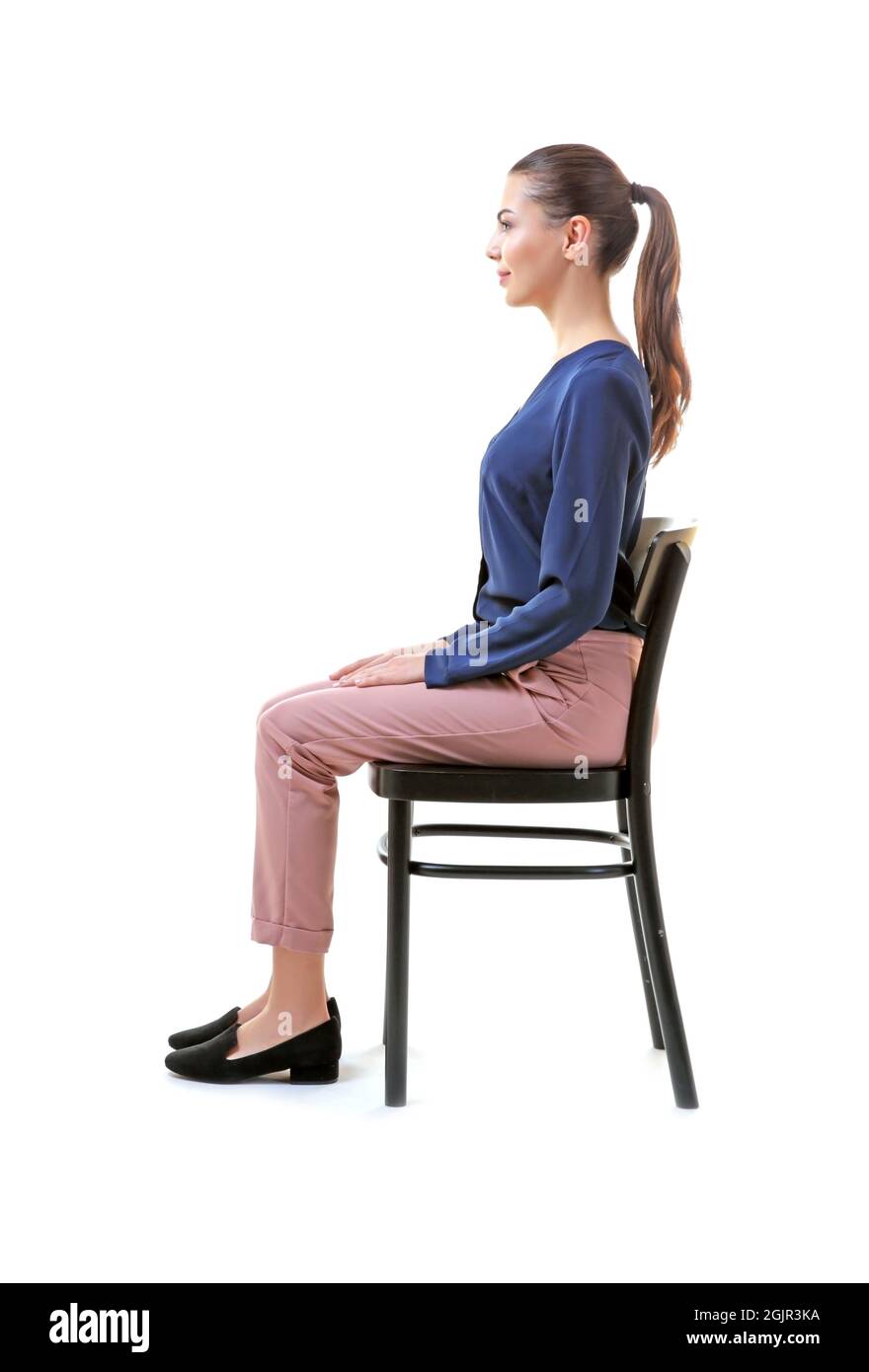 Incorrect posture concept. Young woman sitting on chair against white ...