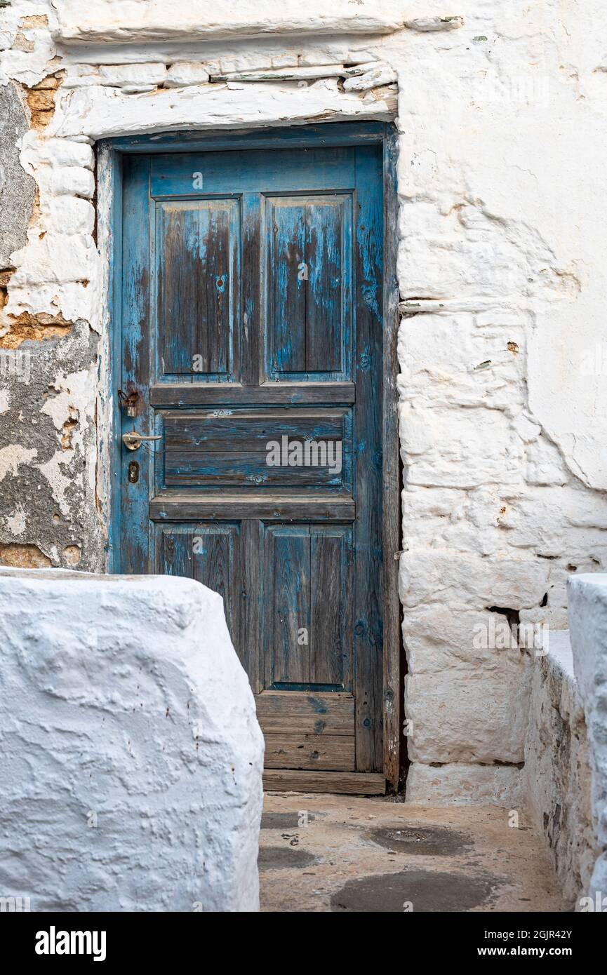 old wooden door in need of paint on a home in Chora Stock Photo - Alamy