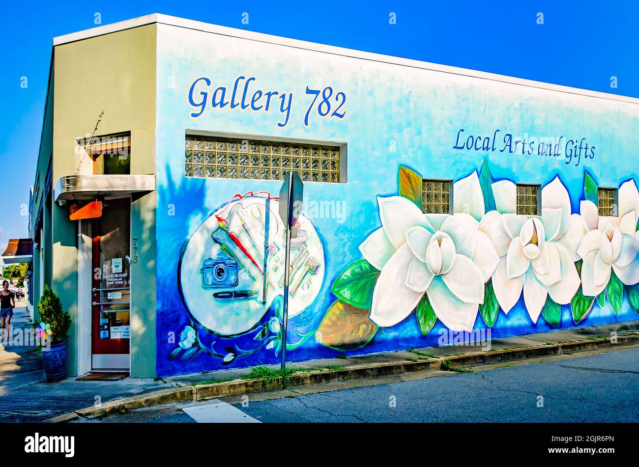A mural of magnolias is painted on the side of the Pringle Building ...