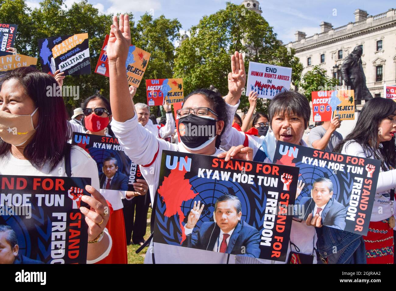 London, UK. 11th Sep, 2021. Protesters hold up the three-finger salute ...