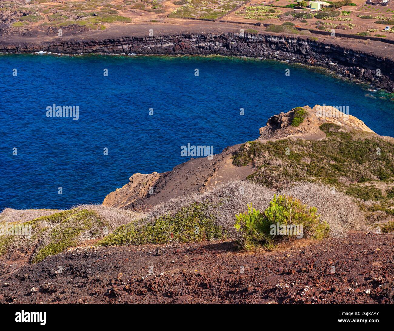 View of the scenic lava rock cliff in the Linosa island. Sicily Stock ...