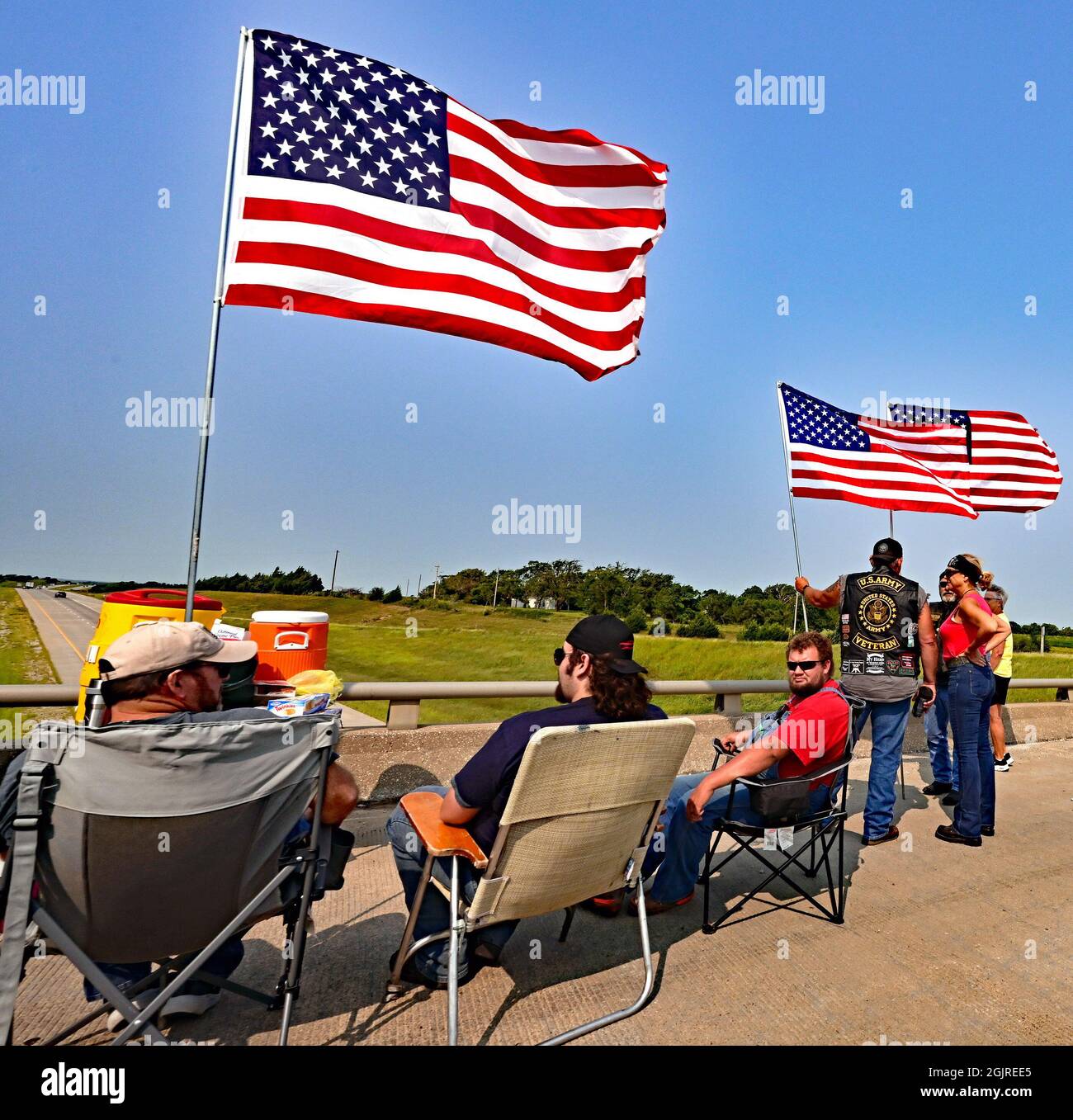 Local people gather with members of the Patriot Guards, along with ...