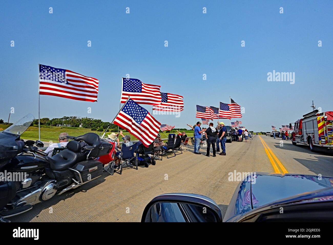 Local people gather with members of the Patriot Guards, along with ...