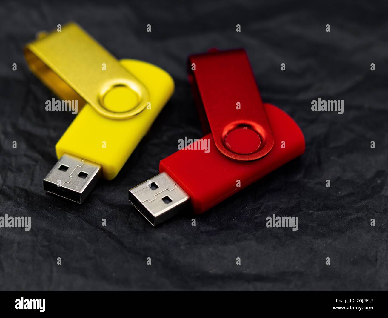 colored usb pen drives on black background Stock Photo - Alamy