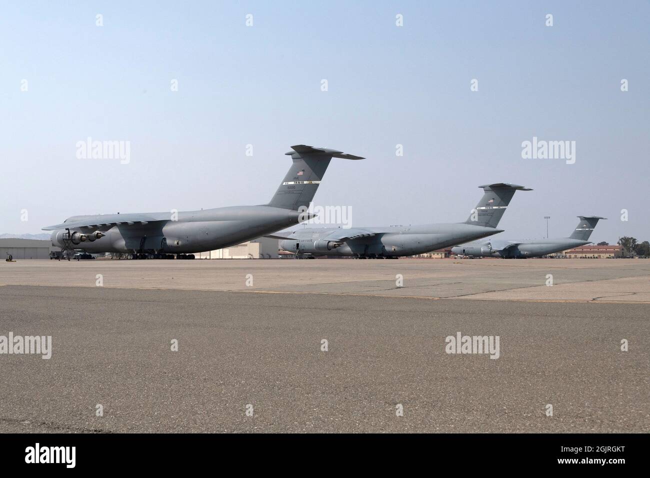 C-5 M Super Galaxy aircraft are parked on the flight line, Aug. 21 ...