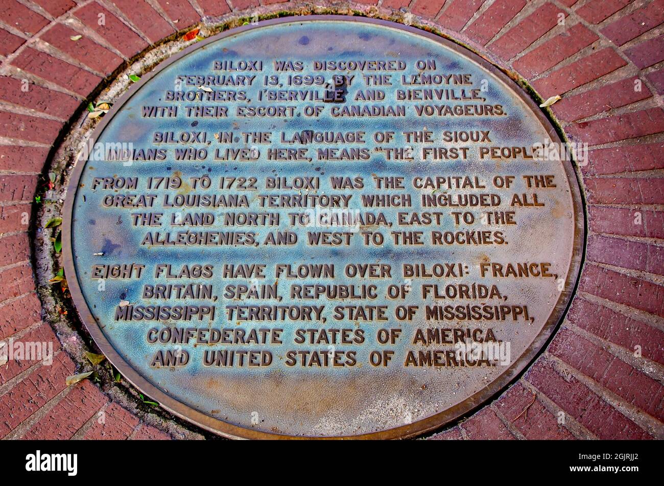 A manhole cover is inscribed with the history of Biloxi, Sept. 5, 2021 ...