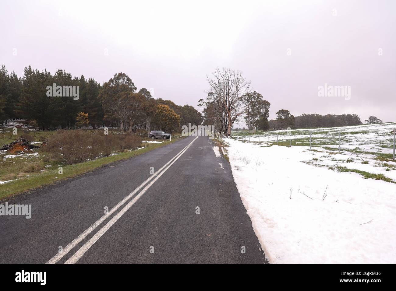 Country road lined with snow, winter in New South Wales, Australia ...