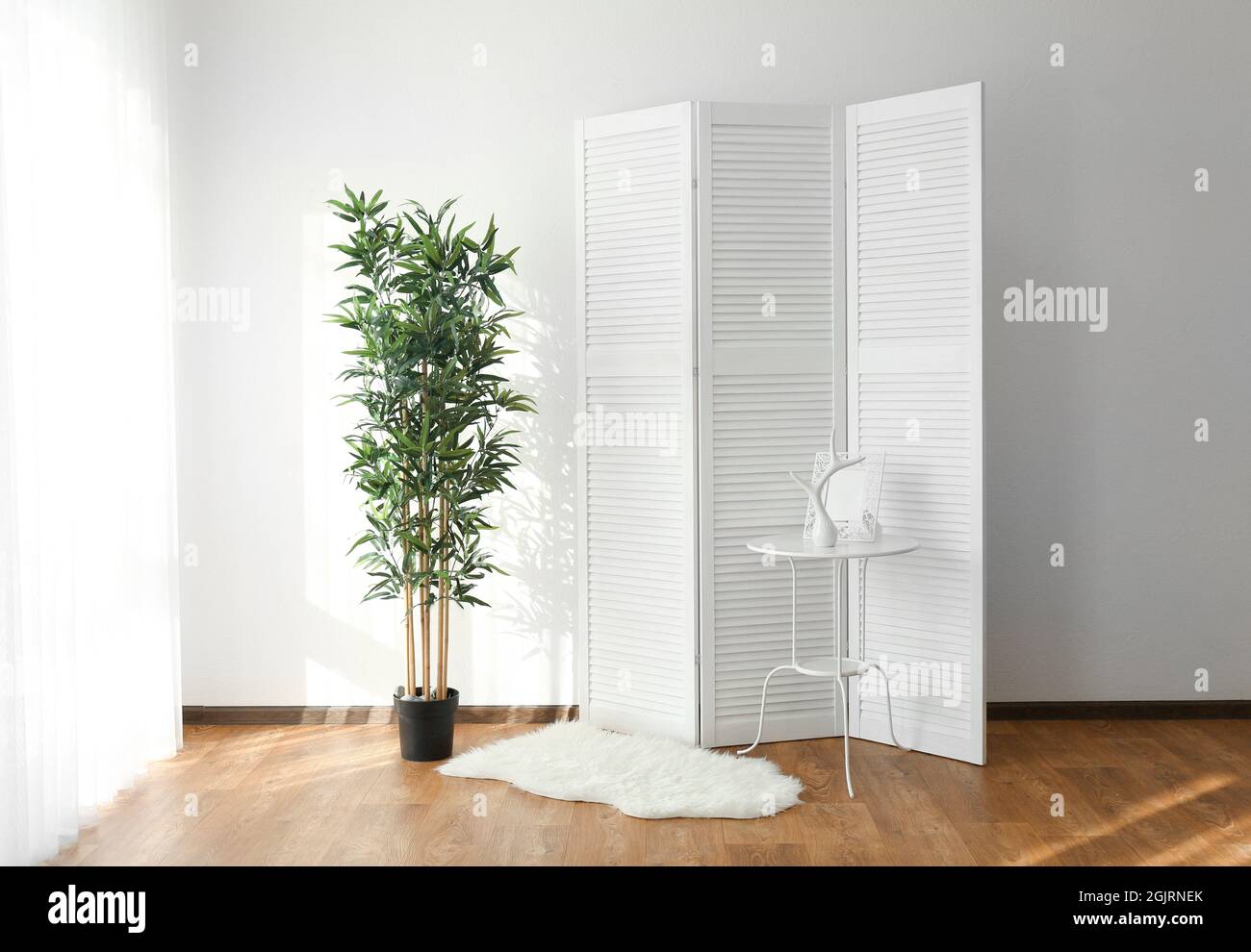 Light room interior with folding screen Stock Photo - Alamy