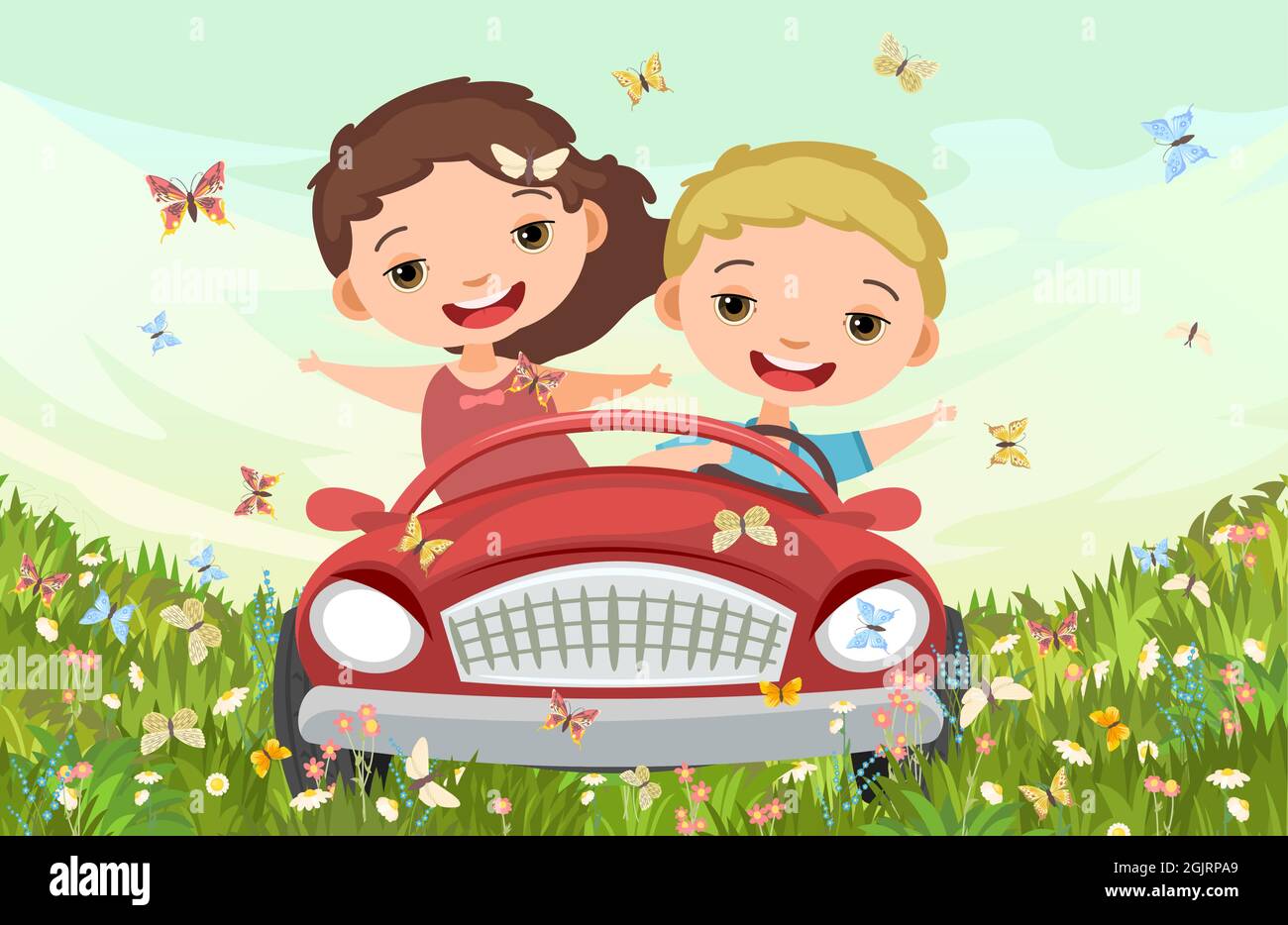 Childrens adventure in small car on flowering meadow. Kid drives pedal ...