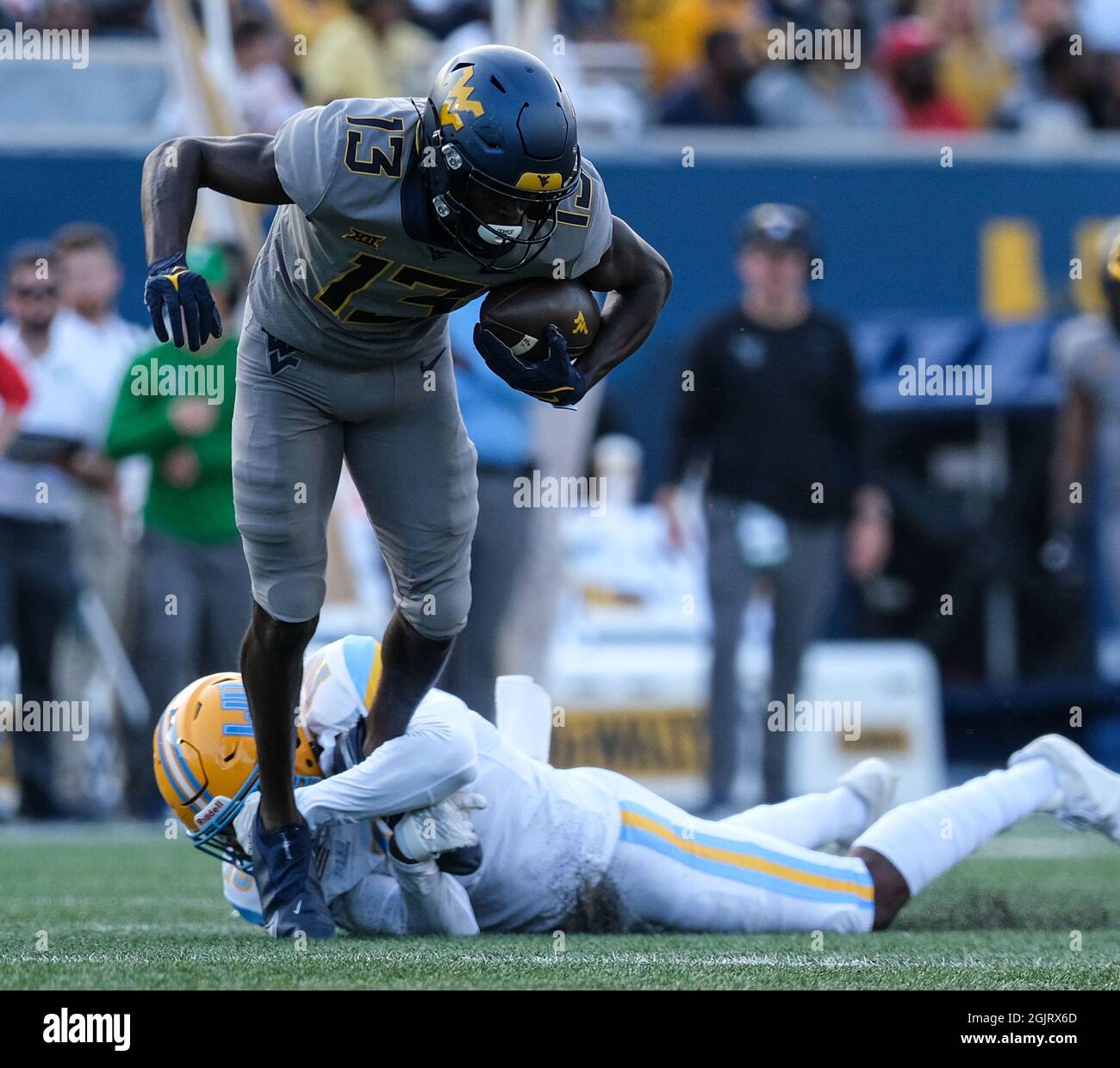 September 11, 2021: West Virginia receiver Sam James (13) is tackled by ...