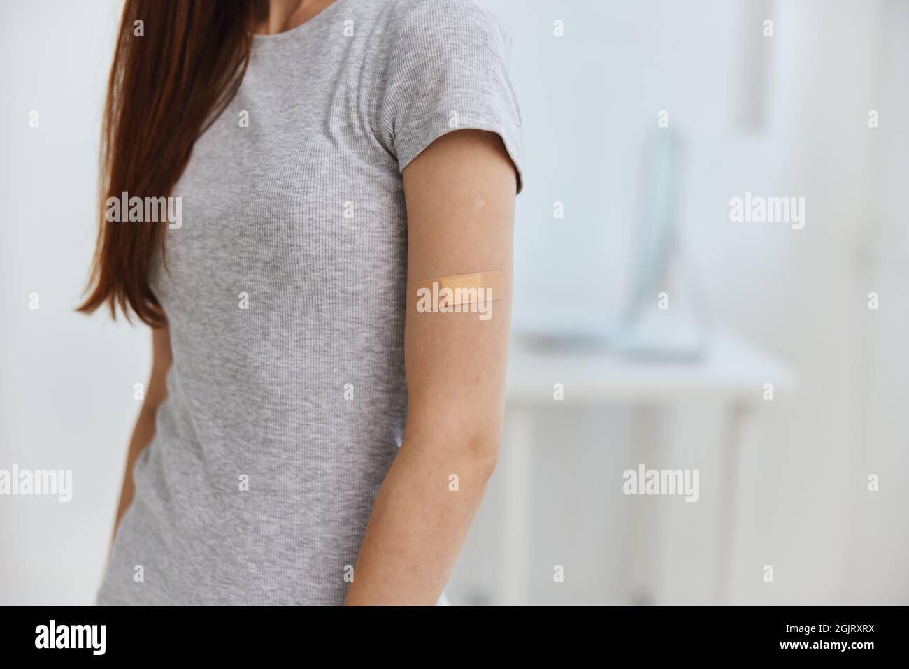 woman hospital with adhesive plaster on shoulder immunity medicine ...