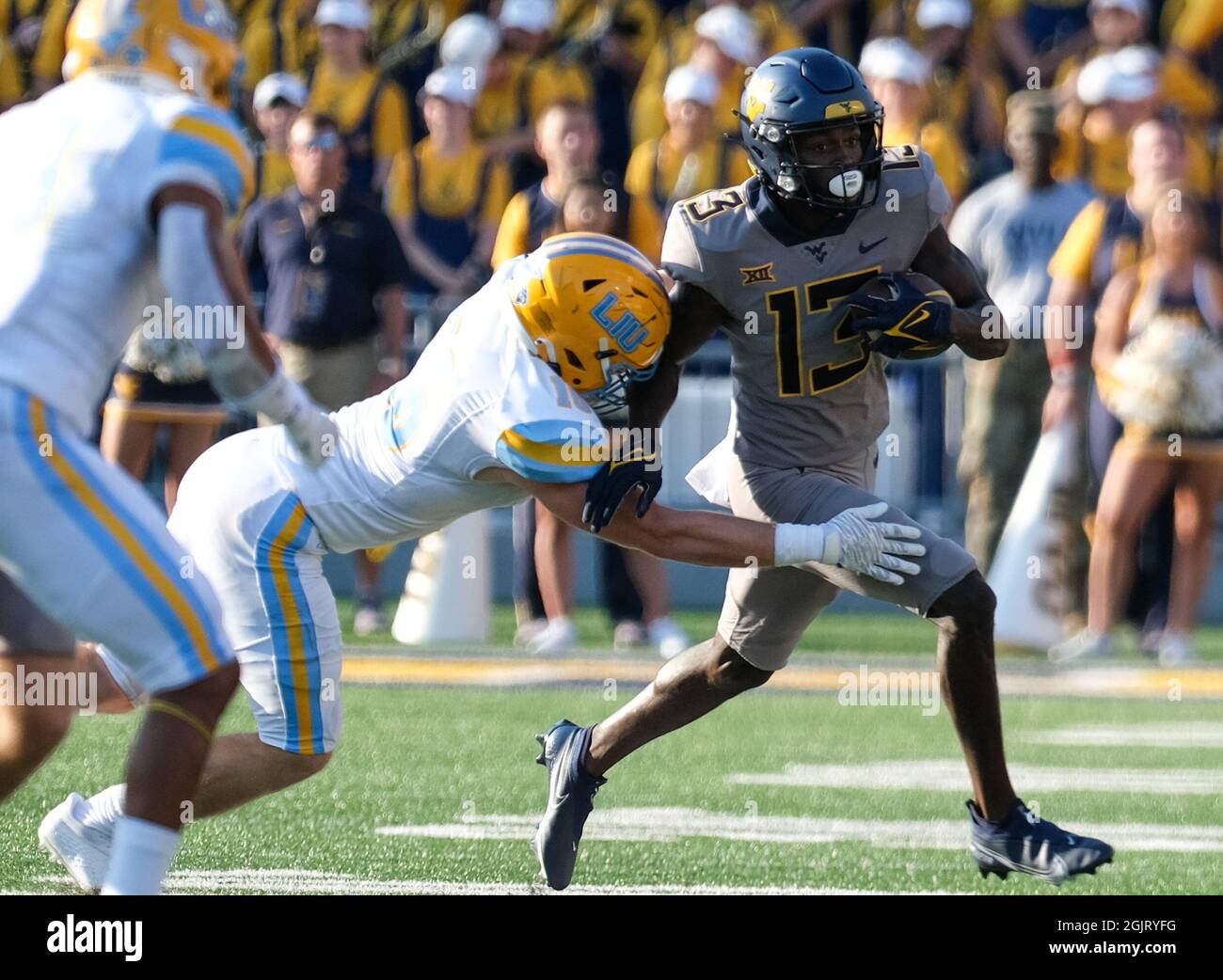 September 11, 2021: West Virginia receiver Sam James (13) is tackled by ...
