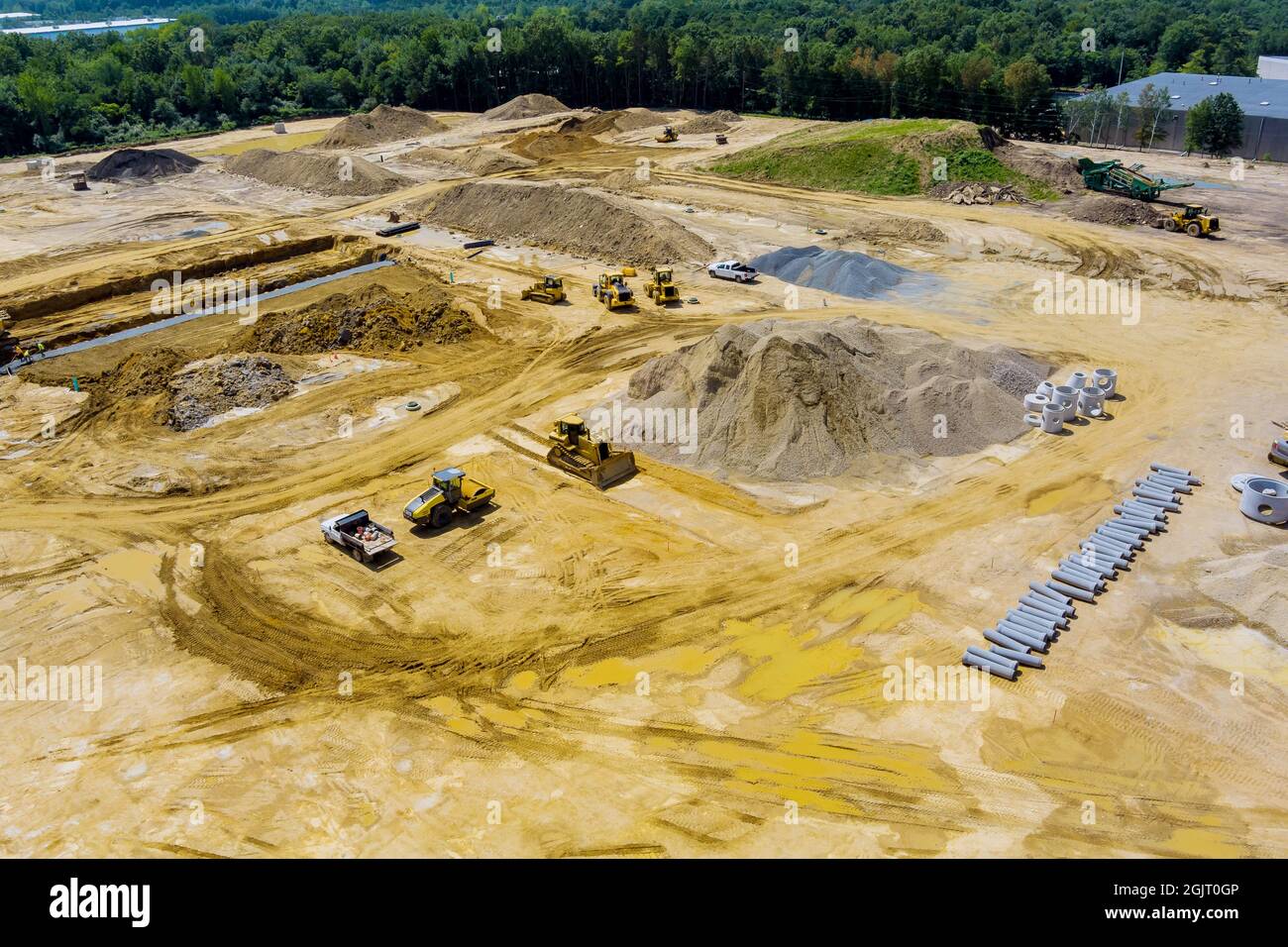 Aerial view at work preparing ground construction in new residential ...