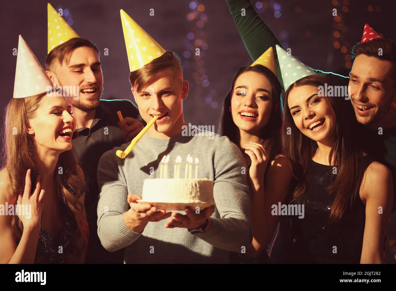 Friends having fun at birthday party in night club Stock Photo - Alamy