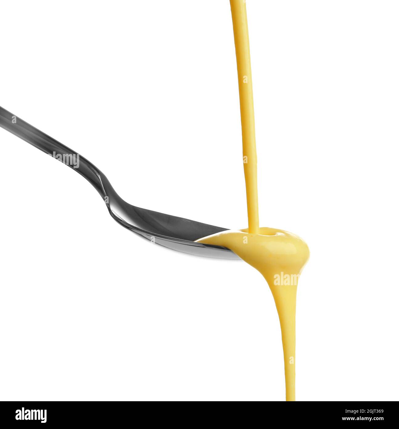 Creamy cheese pouring from spoon, isolated on white Stock Photo - Alamy