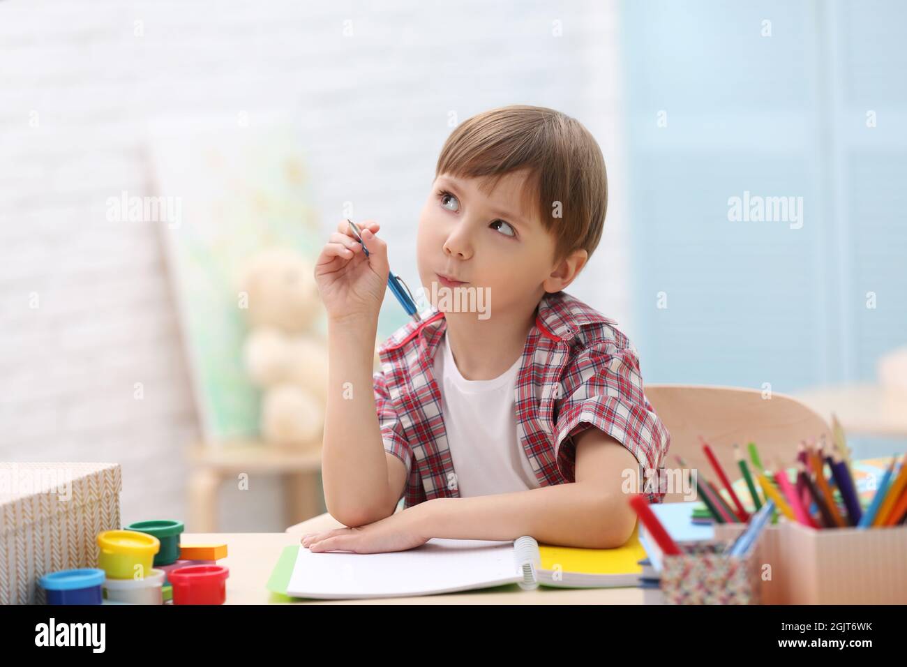 Cute little boy studying at home Stock Photo - Alamy
