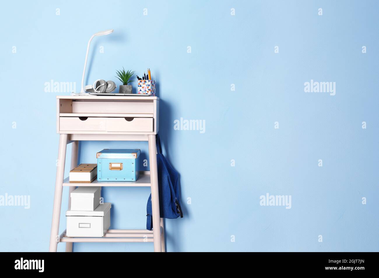 High modern workplace on blue background Stock Photo - Alamy