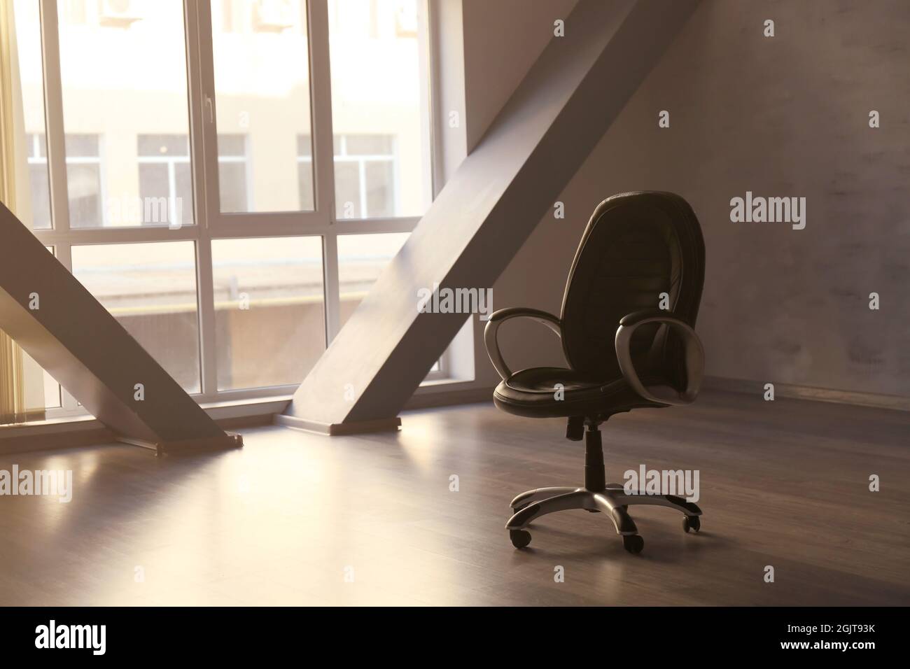 Swivel desk chair in empty office Stock Photo - Alamy