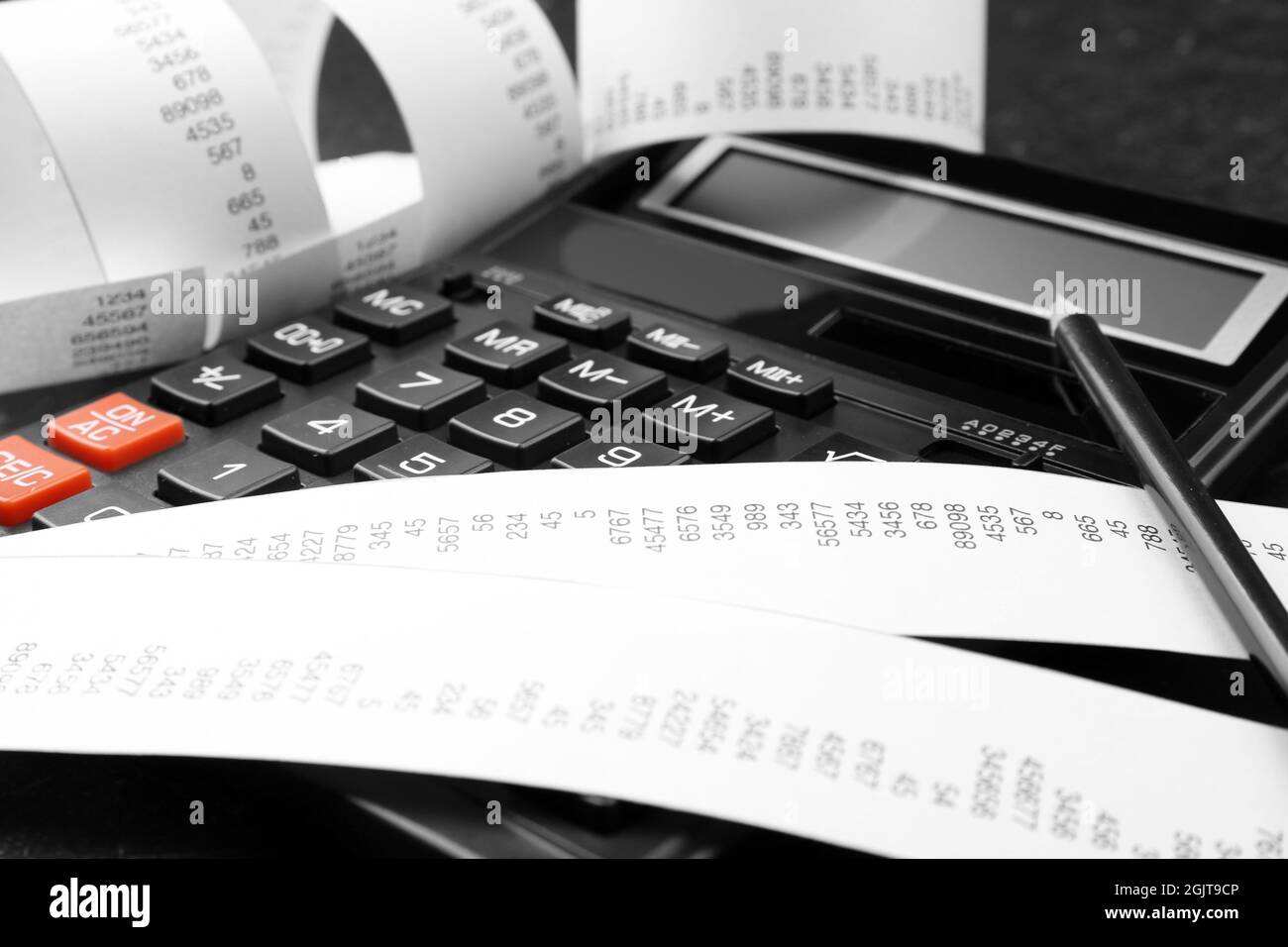 Calculator with adding machine tape, closeup Stock Photo - Alamy