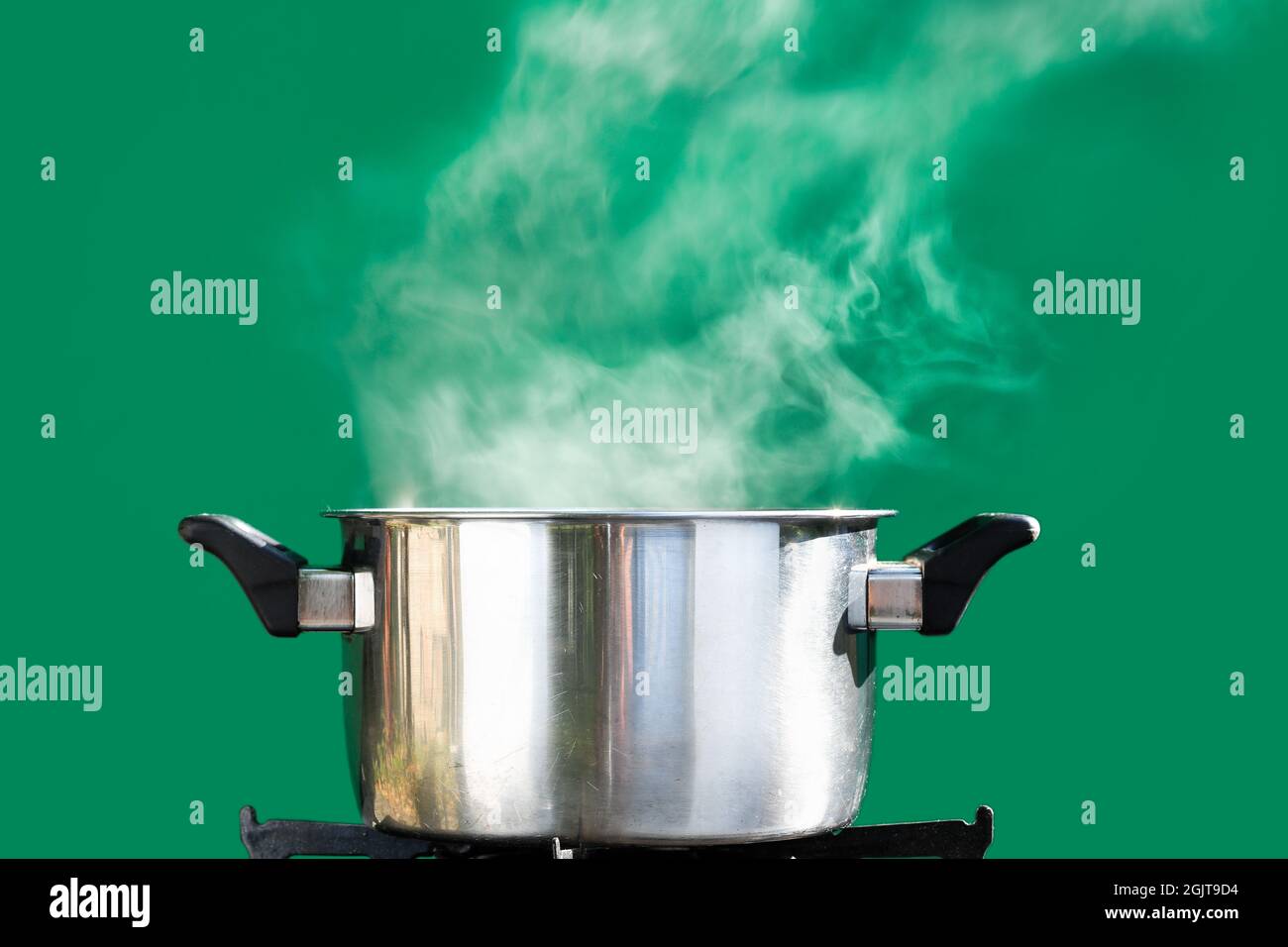steam over cooking pot ,on green screen Stock Photo - Alamy