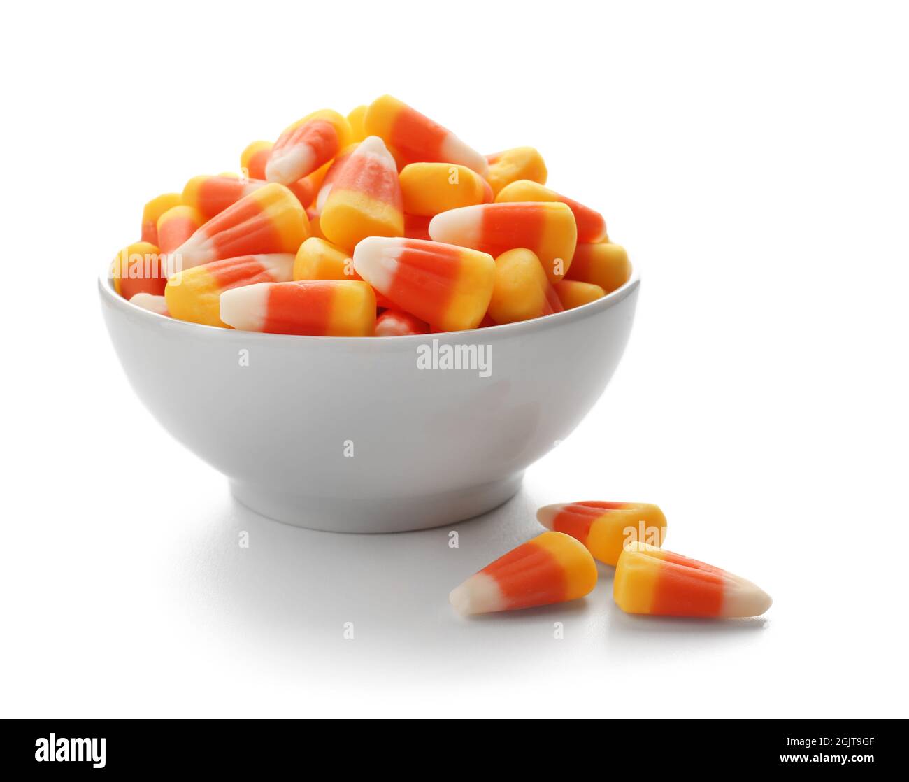 Colorful Halloween candy corns on white background Stock Photo - Alamy