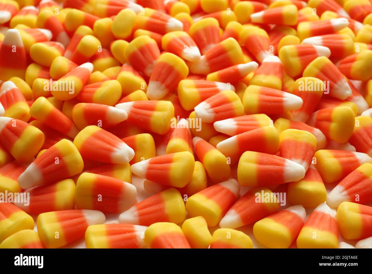 Colorful Halloween candy corns background Stock Photo - Alamy