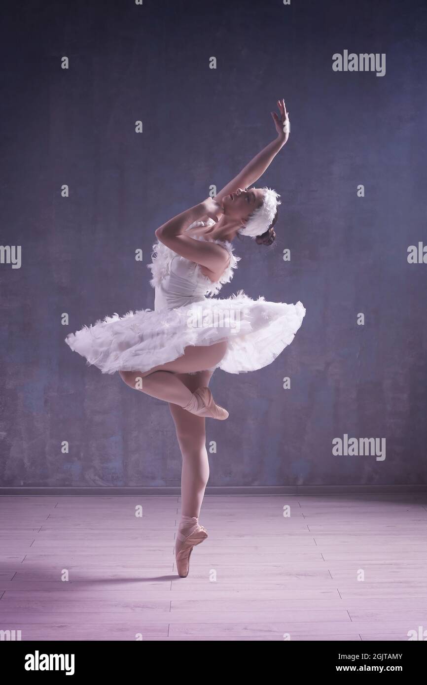 Young beautiful ballerina dancing in studio Stock Photo - Alamy