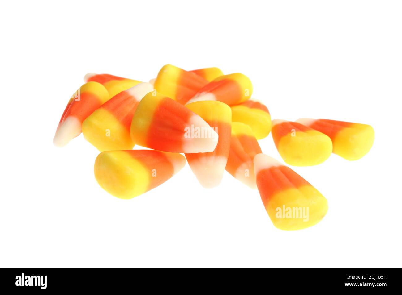 Colorful Halloween candy corns on white background Stock Photo - Alamy