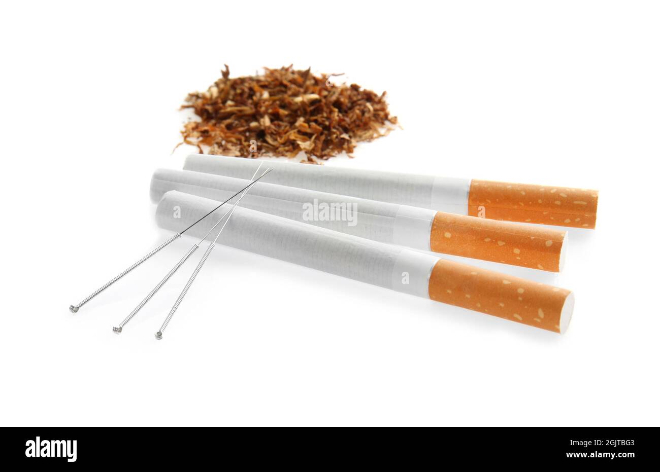 Cigarettes with needles and tobacco on white background Stock Photo - Alamy