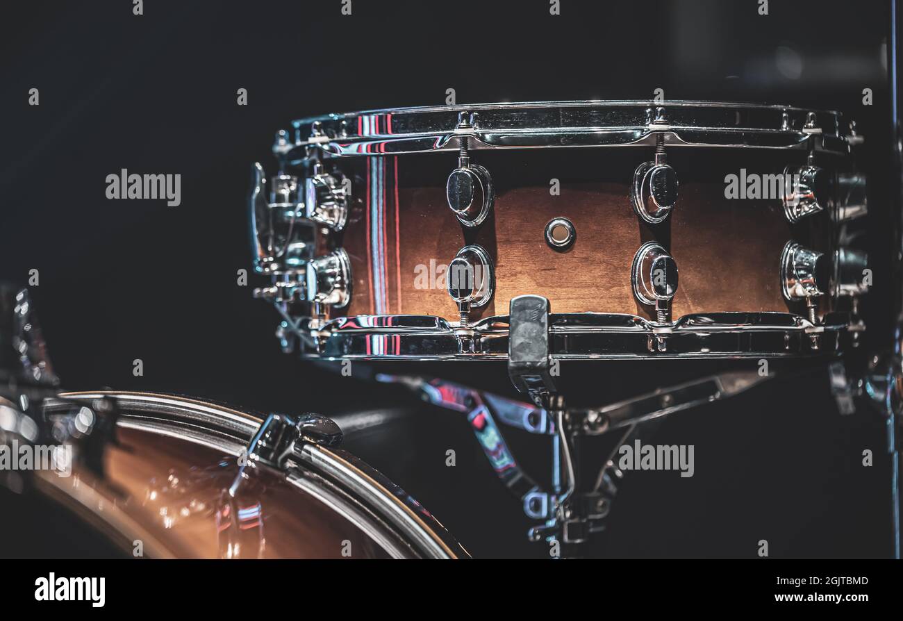 Close-up of a snare drum, percussion instrument on a dark background ...