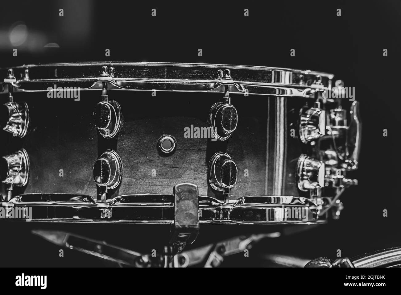 Close-up of a snare drum, percussion instrument on a dark background ...