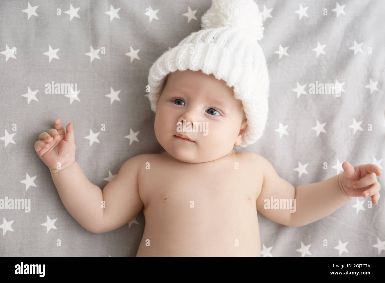 Cute little baby lying in cradle at home Stock Photo - Alamy