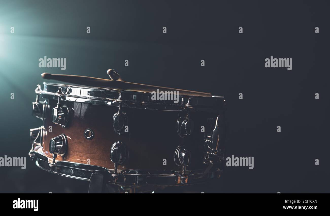 Close-up of a snare drum, percussion instrument on a dark background ...