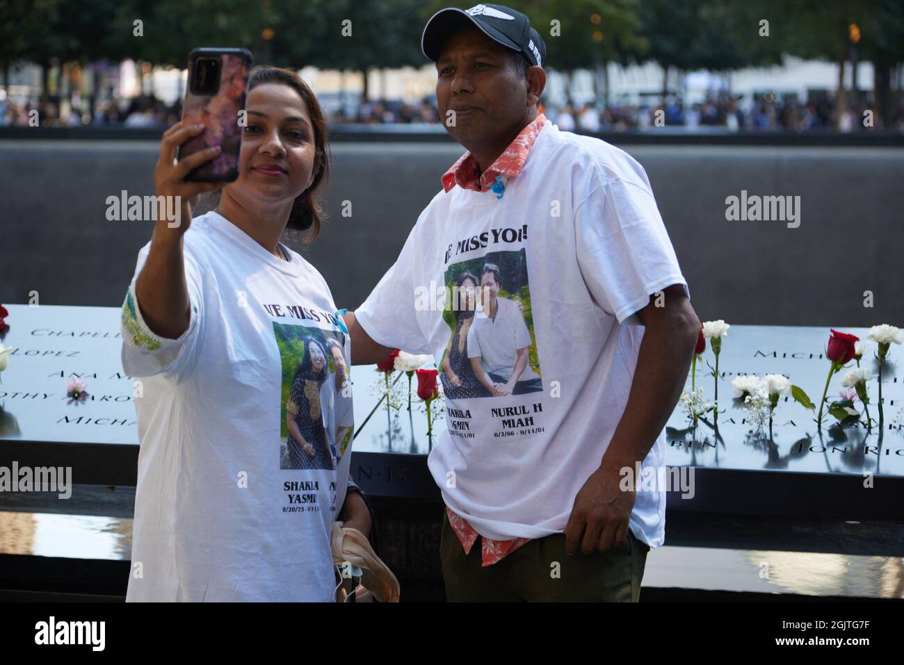 A woman and a man remembering Shakia Yasmin and Nurul H. Miah, who died on September 11, 2001 as ...