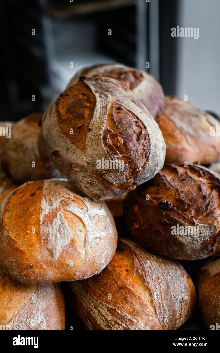 Lots of wheat bread on a table in a bakery Stock Photo - Alamy