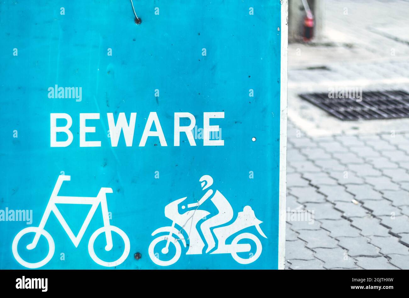 Beware Of Cyclists Road Safety blue Sign Stock Photo - Alamy
