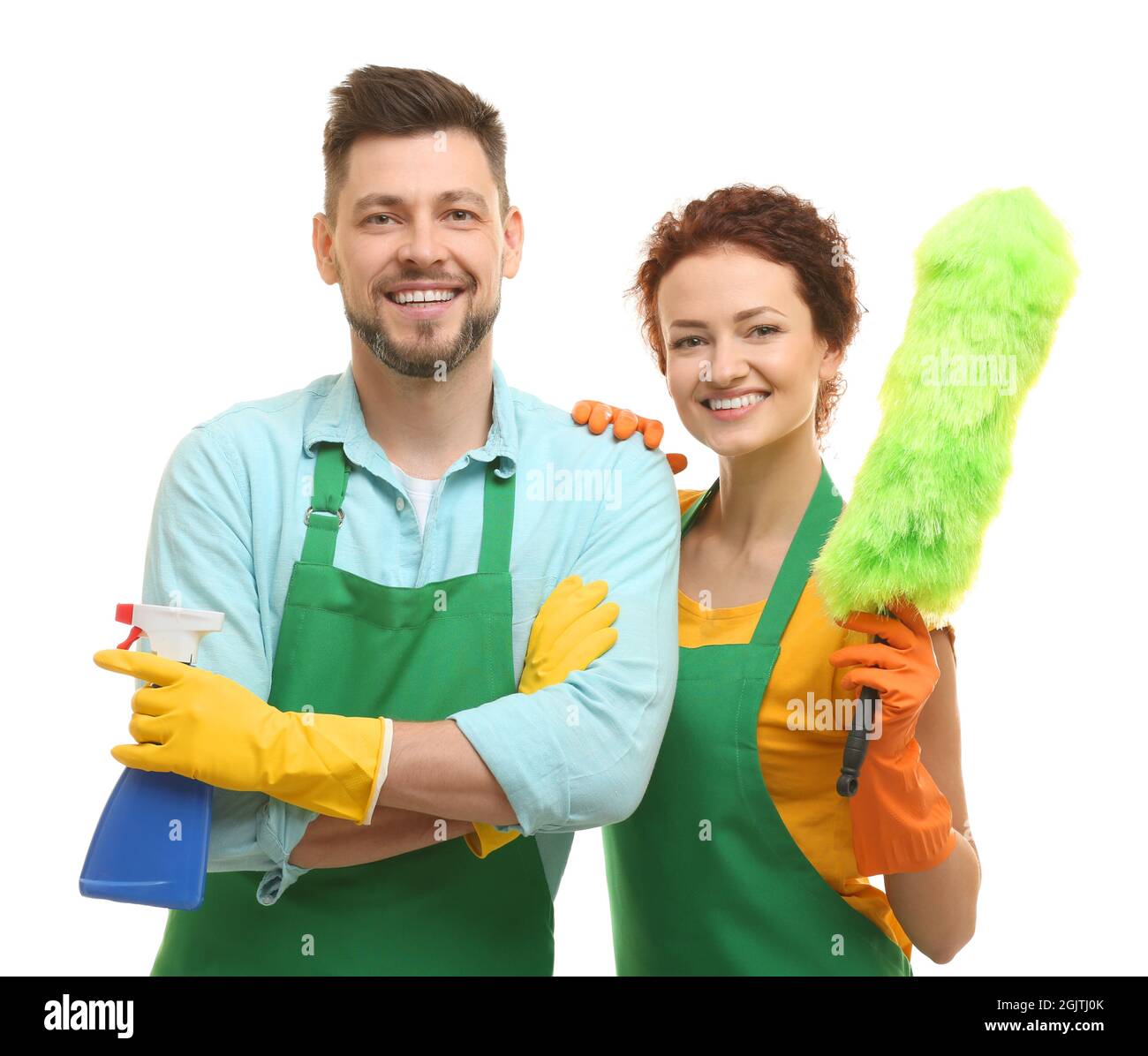 Couple with cleaning supplies on white background Stock Photo - Alamy