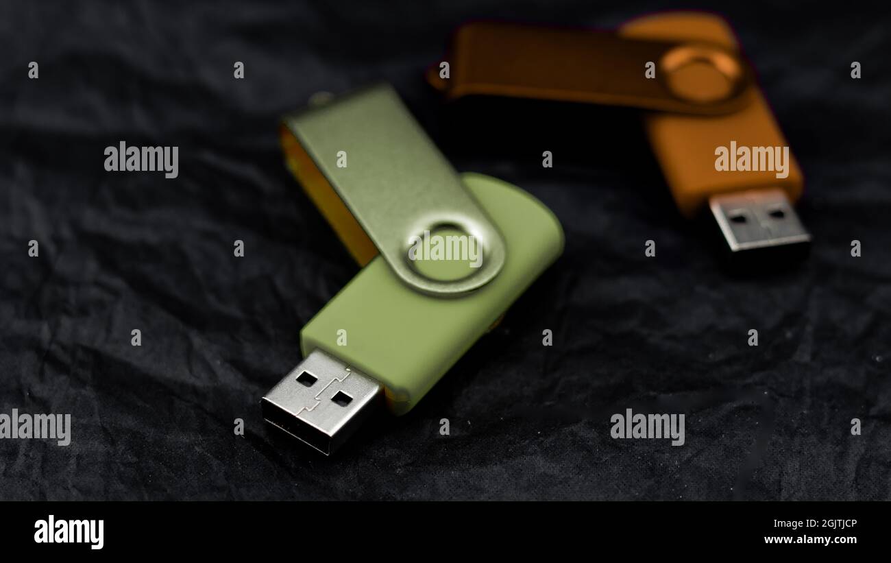 colored usb drives on black background Stock Photo - Alamy