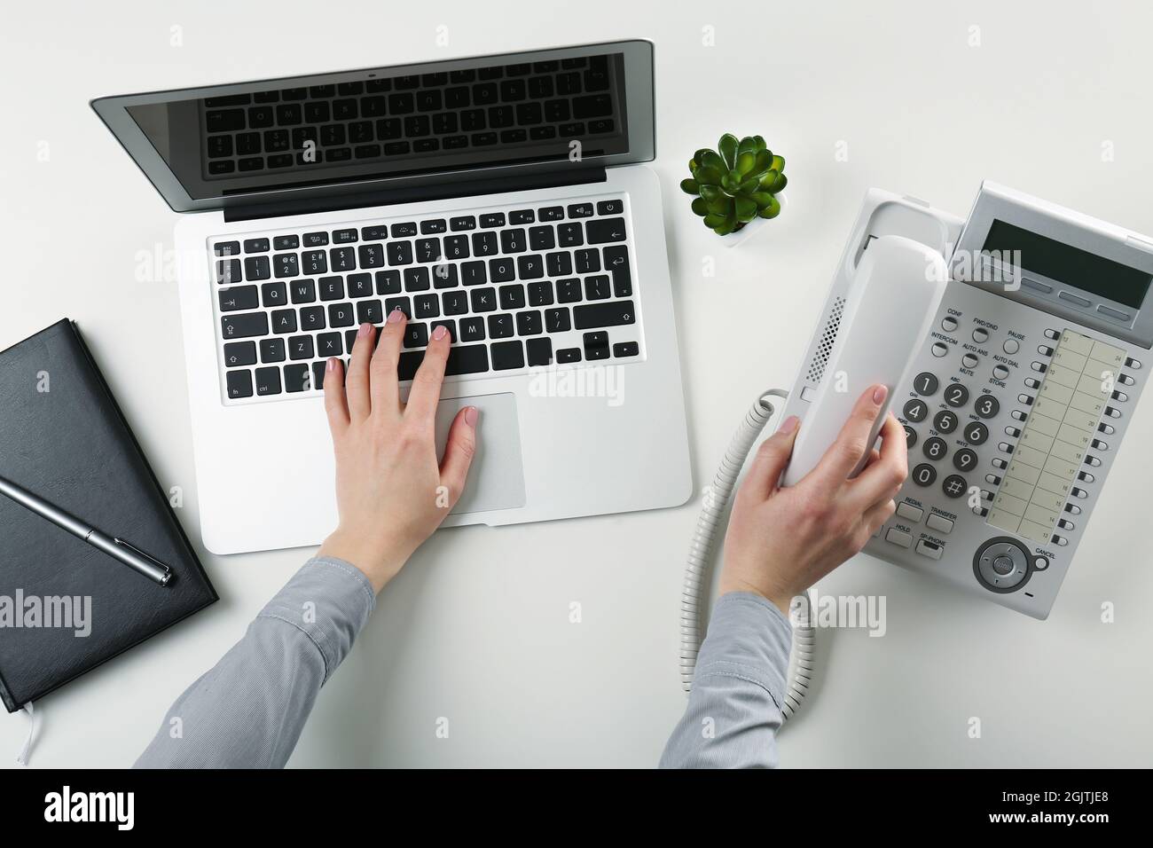 Hands of technical support agent at workplace Stock Photo - Alamy