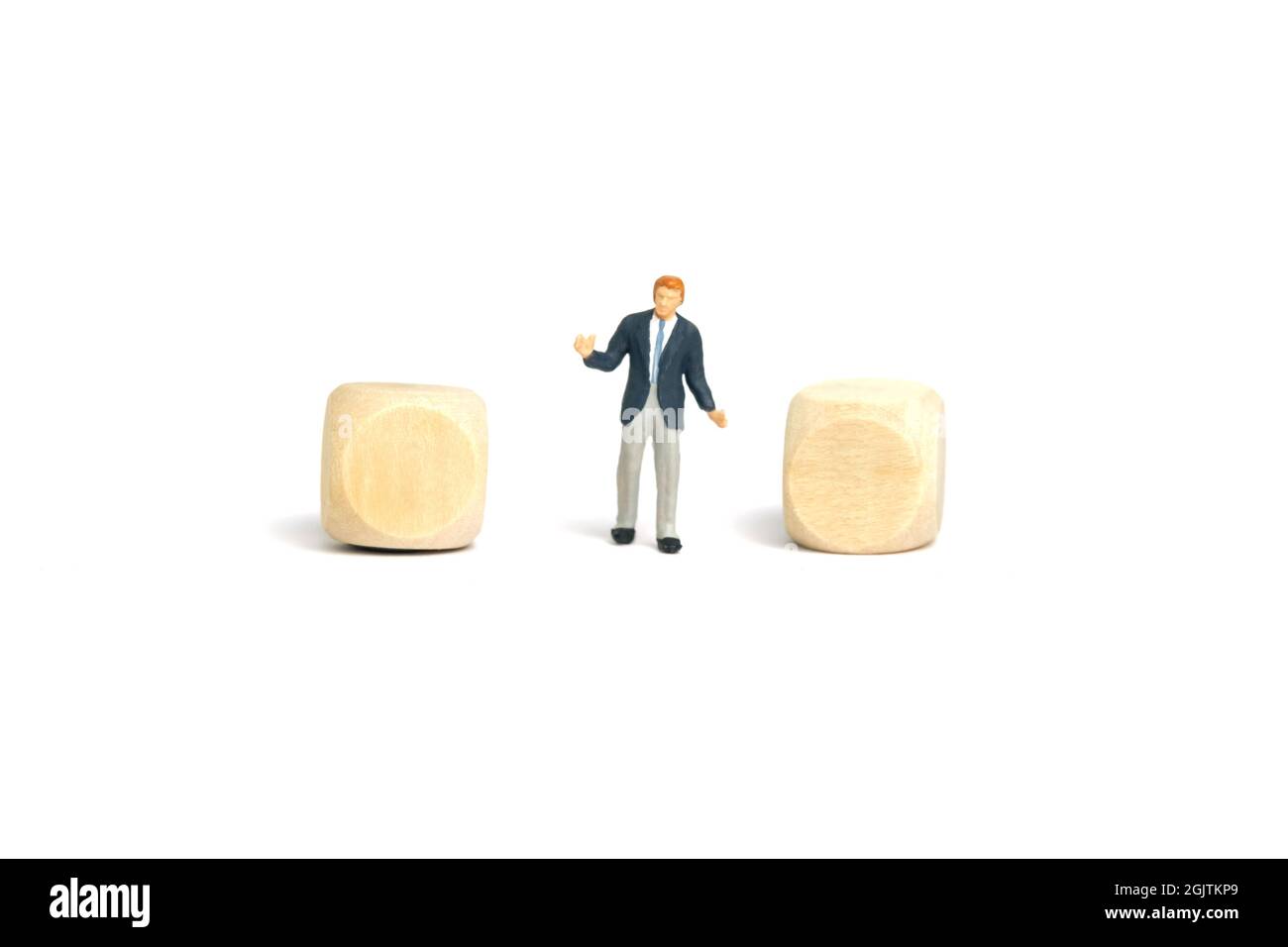 Miniature people toy figure photography. A shrugging businessman ...