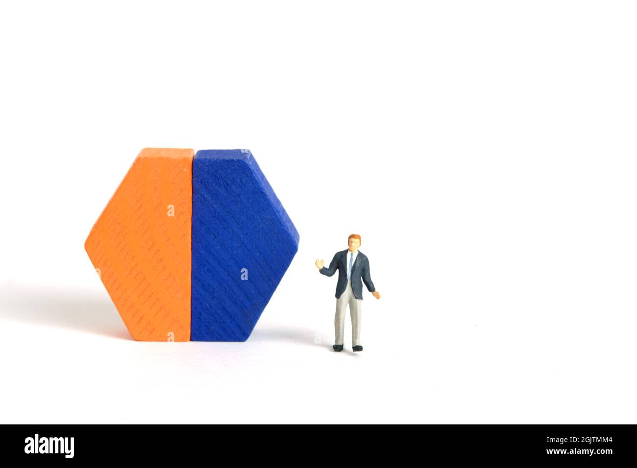 Miniature people toy figure photography. A shrugging businessman doing ...